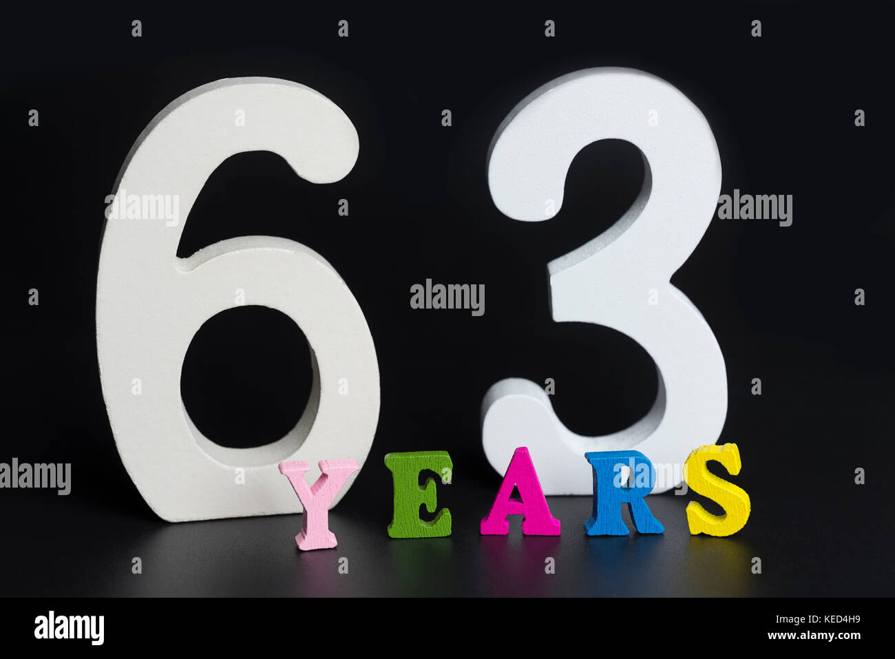 Letters and numbers-sixty-three on black isolated background Stock ...