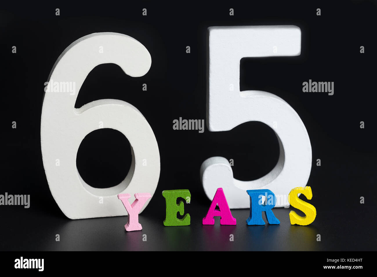 Letters and numbers sixty-five on black isolated background Stock Photo ...