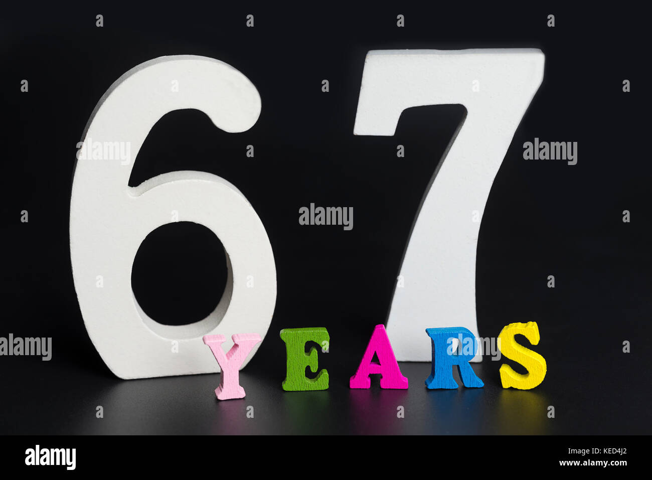 Letters and numbers-sixty-seven on black isolated background Stock ...