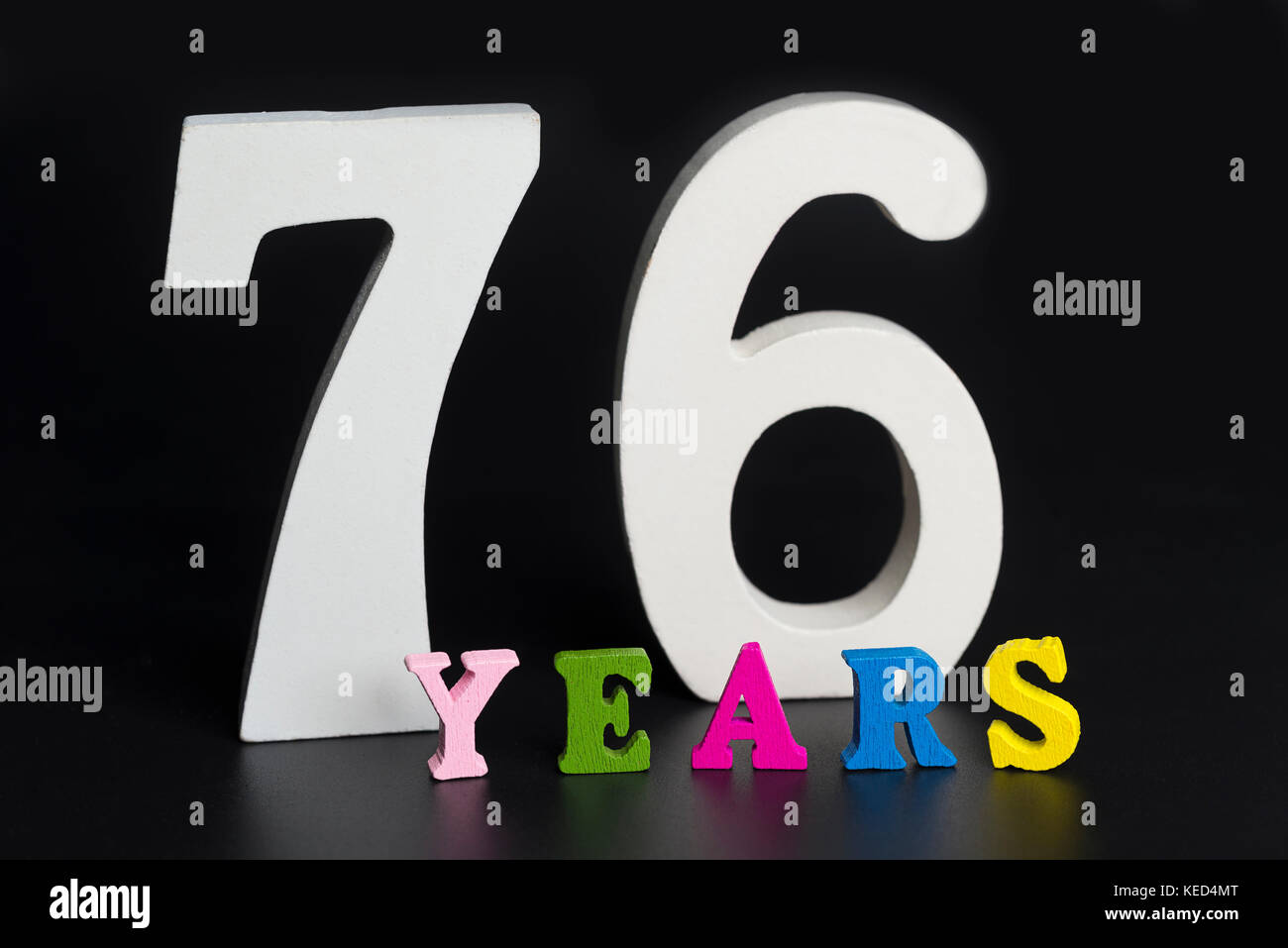 Letters and numbers-seventy-six on a black isolated background Stock ...