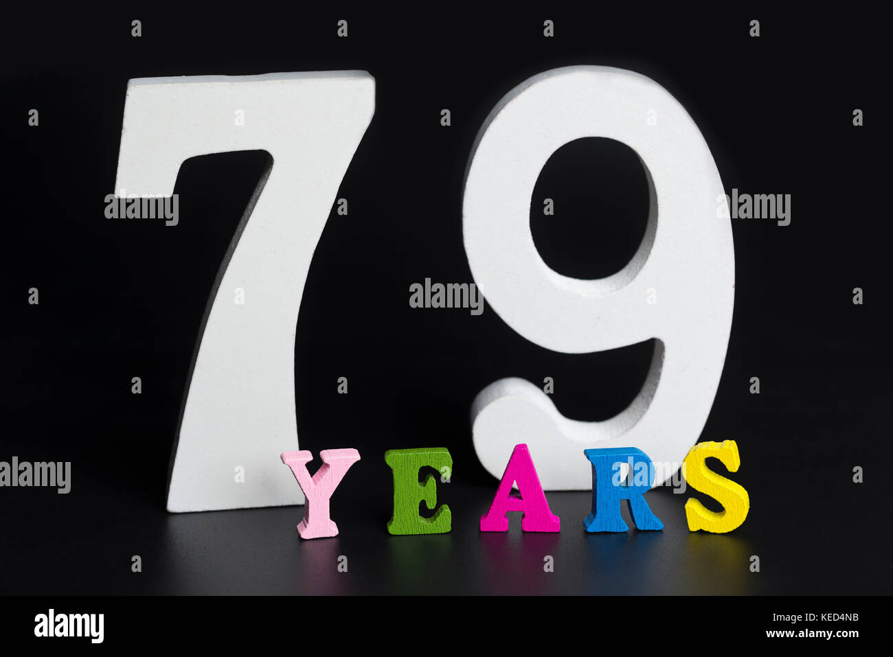 Letters and numbers-seventy-nine on a black isolated background Stock ...