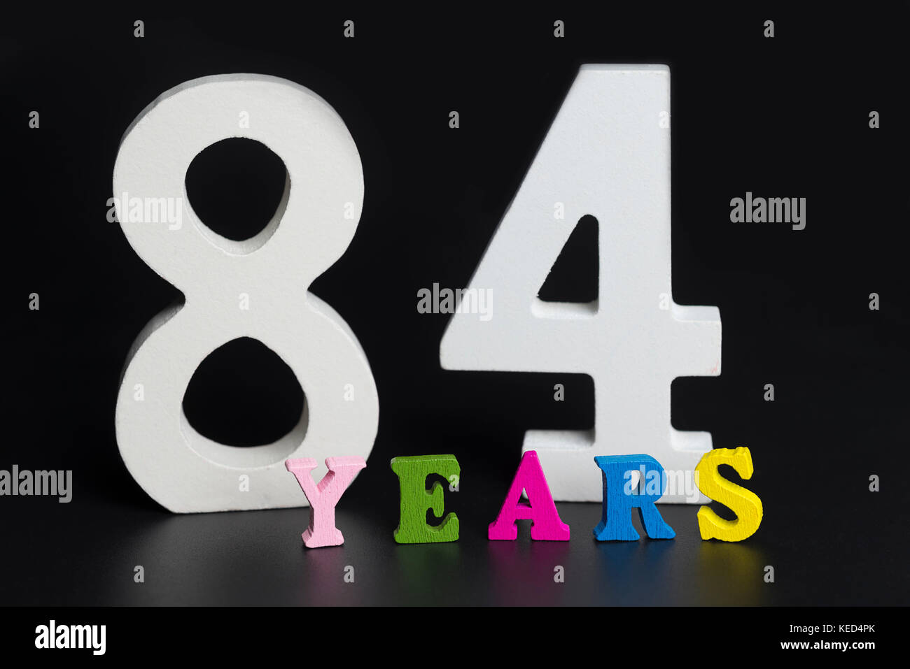 Letters and numbers eighty-four on a black isolated background Stock ...