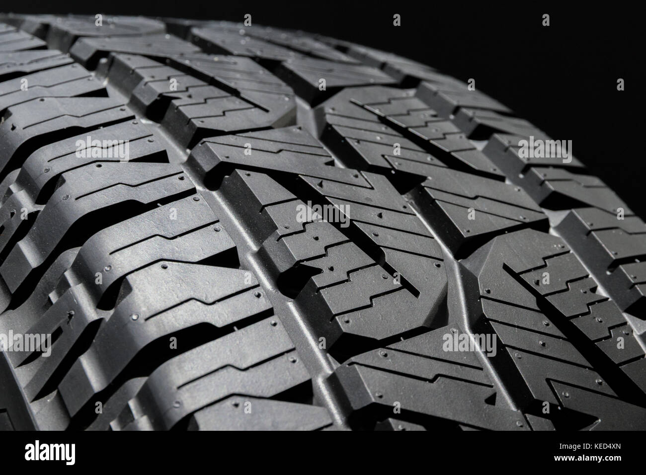 car tire profile on a black background Stock Photo - Alamy