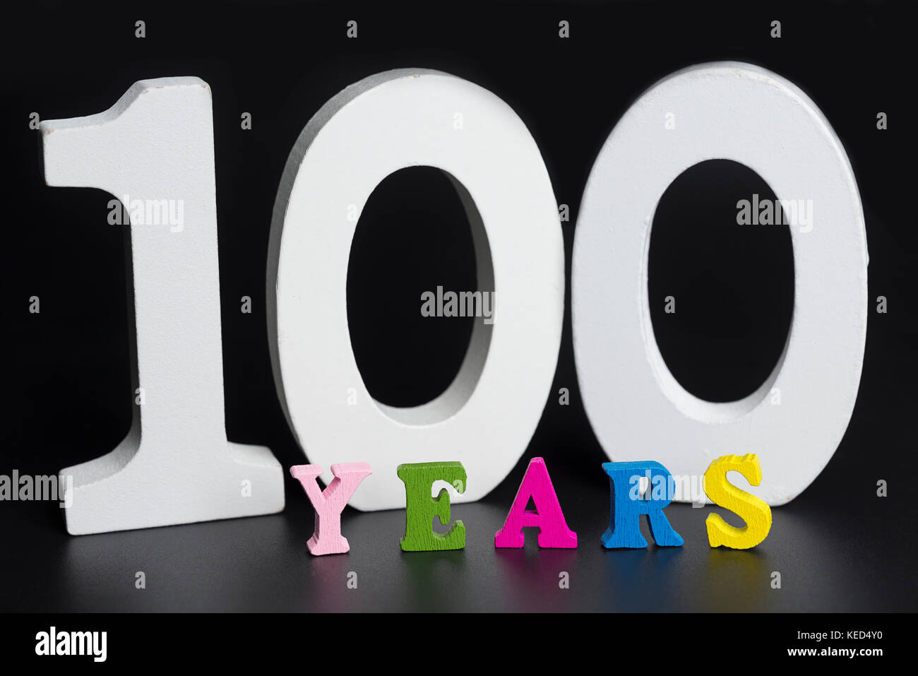 Letters and numbers-a hundred on black isolated background Stock Photo ...