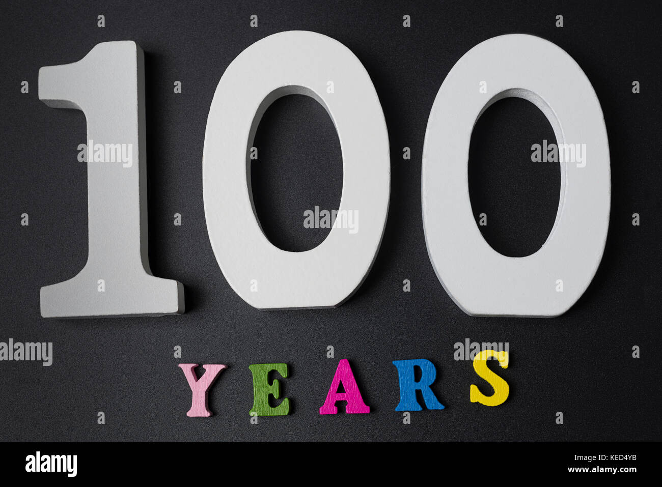 Letters and numbers-a hundred on black isolated background Stock Photo ...