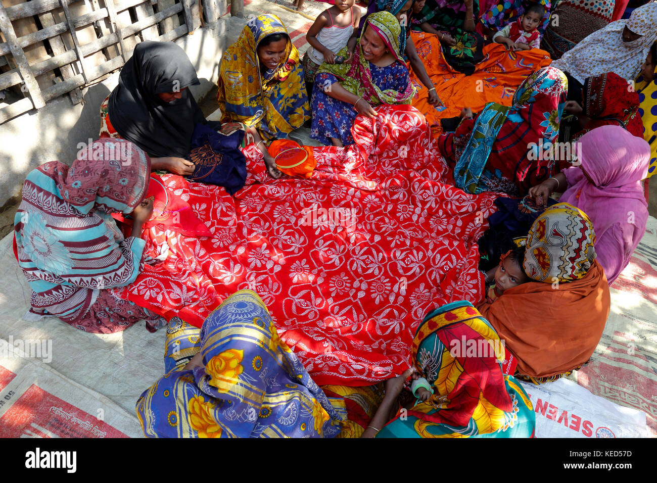 Rural women make Nakshi Kantha, a type of embroidered quilt at a ...