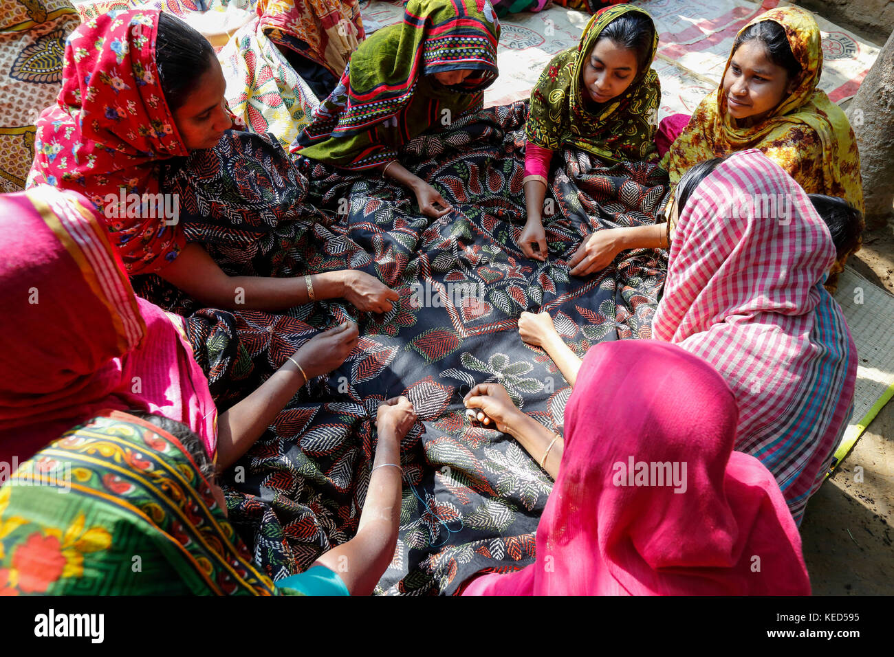 Rural women make Nakshi Kantha, a type of embroidered quilt at a ...