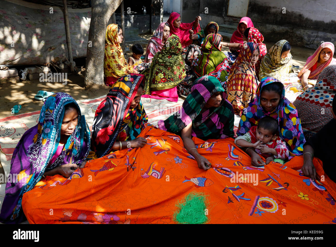 Rural women make Nakshi Kantha, a type of embroidered quilt at a ...