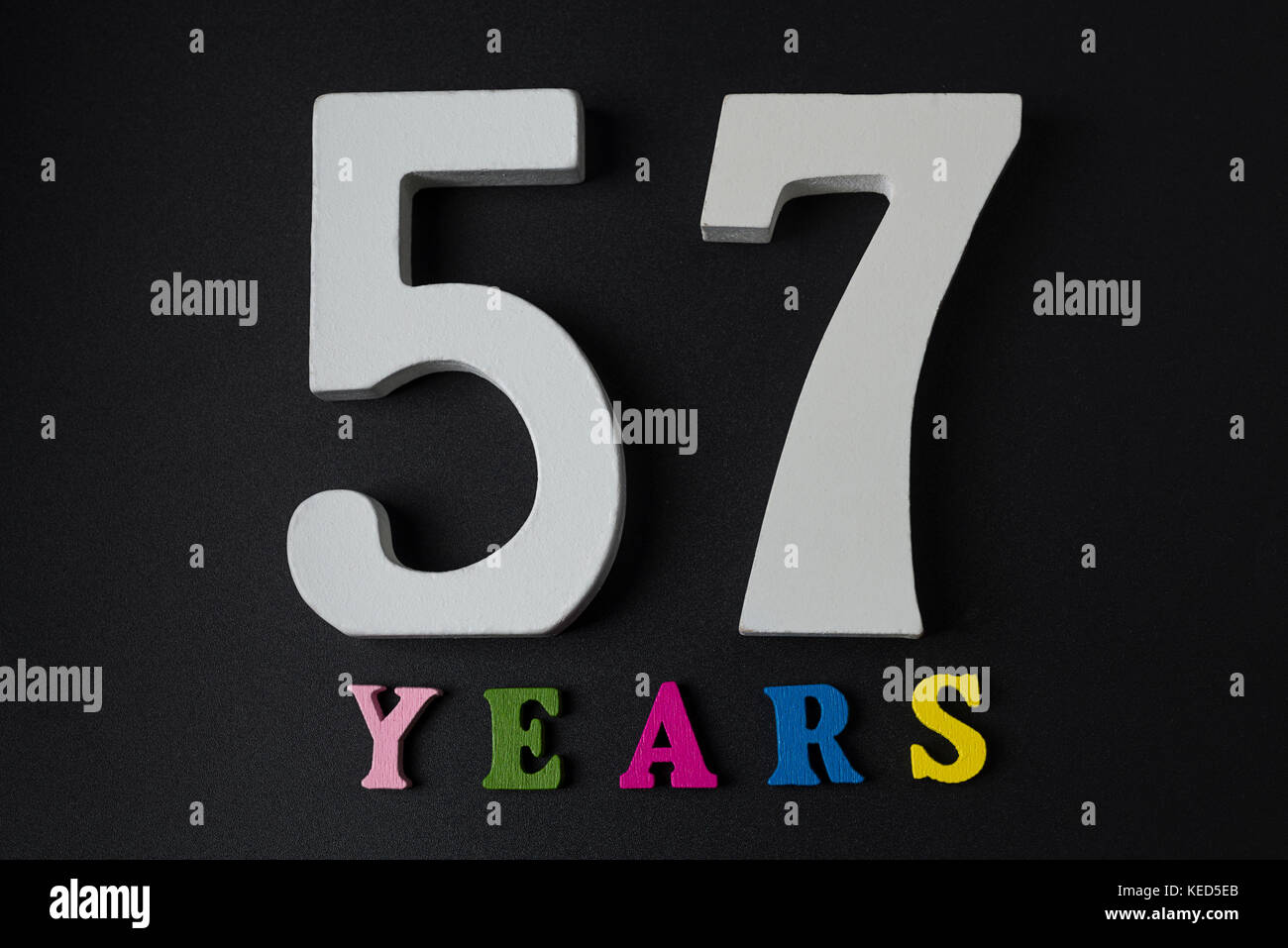 Letters and numbers-fifty-seven on black isolated background Stock ...