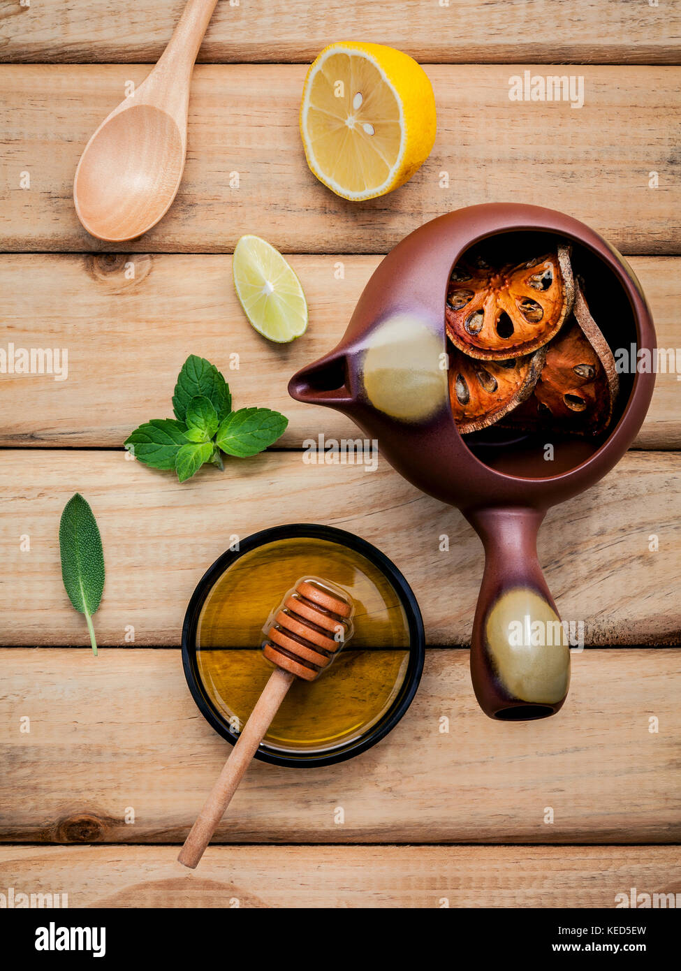 Herbal tea pot with fresh herbs sage ,peppermint ,dried indian bael ...