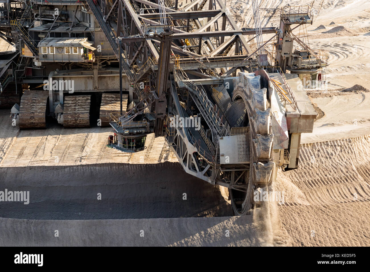 Huge bucket-wheel excavator mining lignite (brown-coal) in an open pit ...