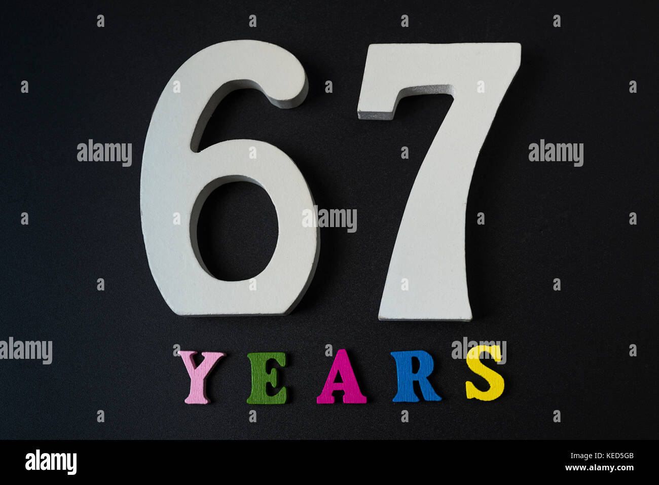 Letters and numbers-sixty-seven on black isolated background Stock ...