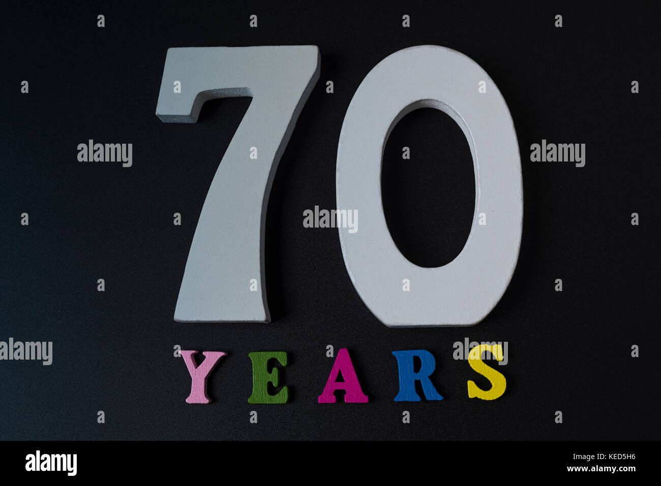 Letters and numbers-seventy on black isolated background Stock Photo ...