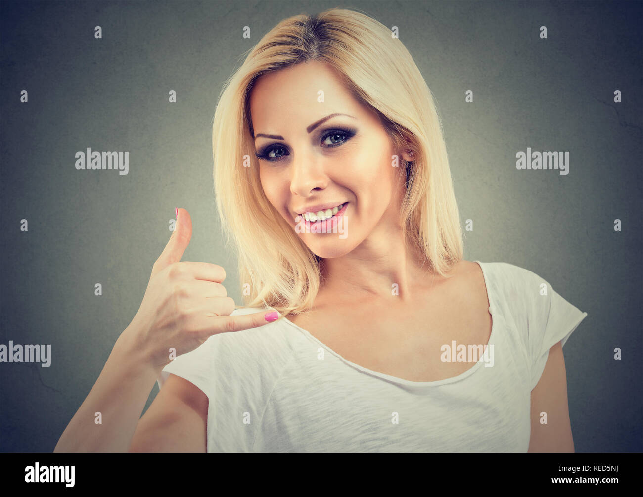 Beautiful woman making call gesture hi-res stock photography and images ...