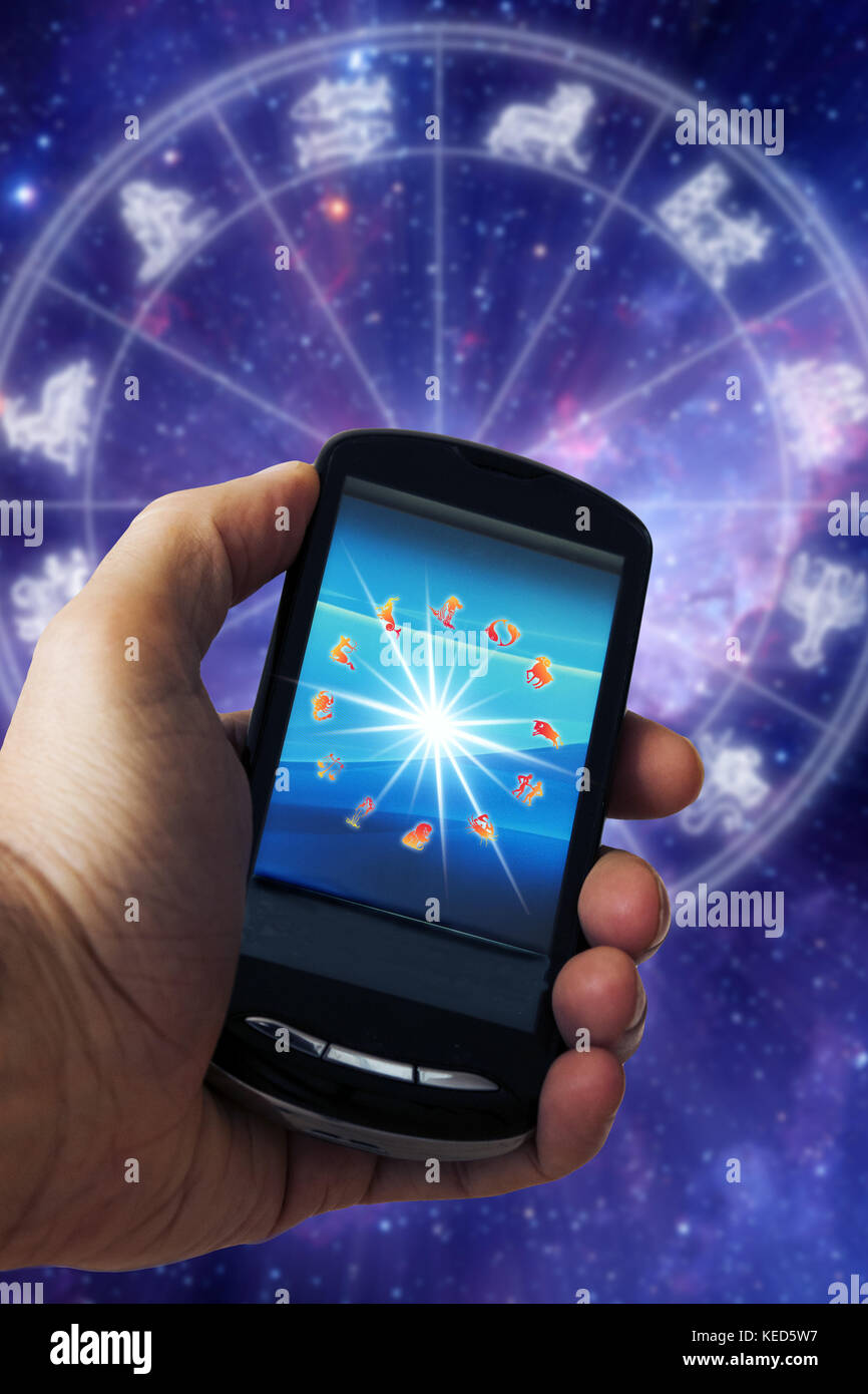 astrology online with mobile phone concept Stock Photo - Alamy