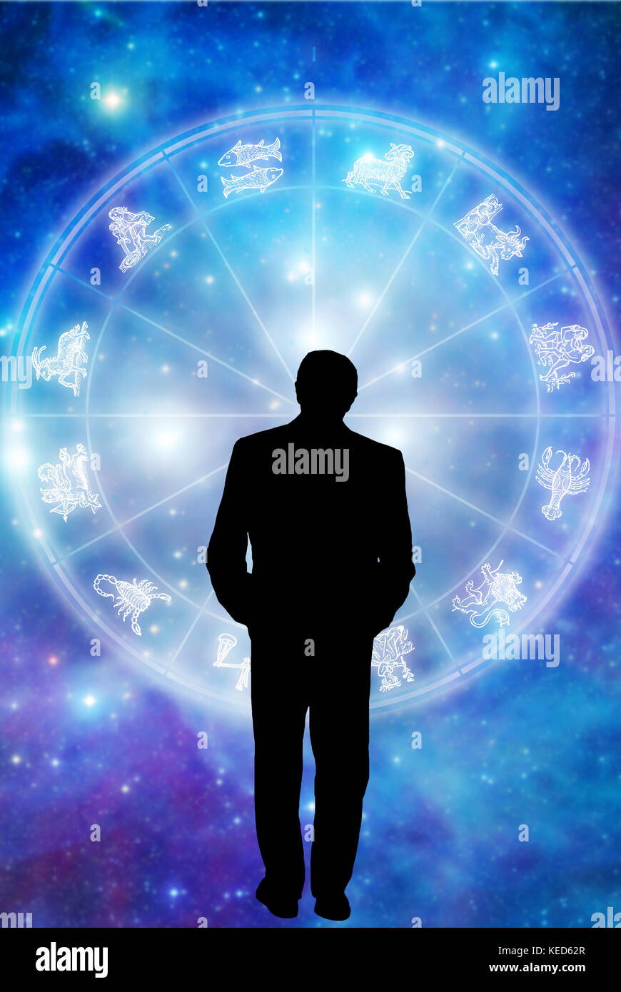 silhouette of a man in suit standing in front of an astrology wheel ...