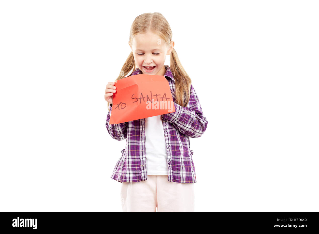Holding letter to Santa Stock Photo - Alamy
