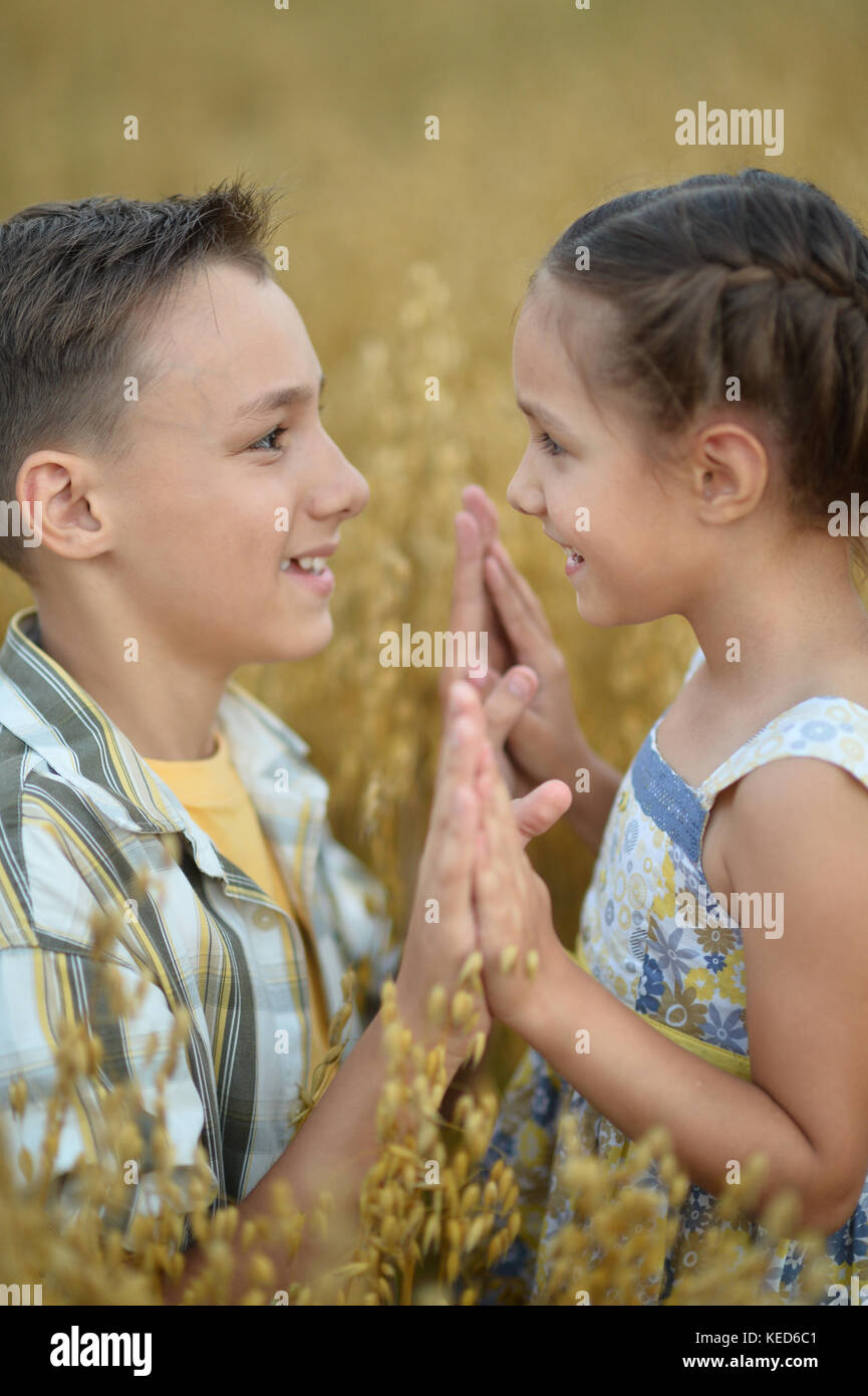 happy kids in field at summer Stock Photo - Alamy