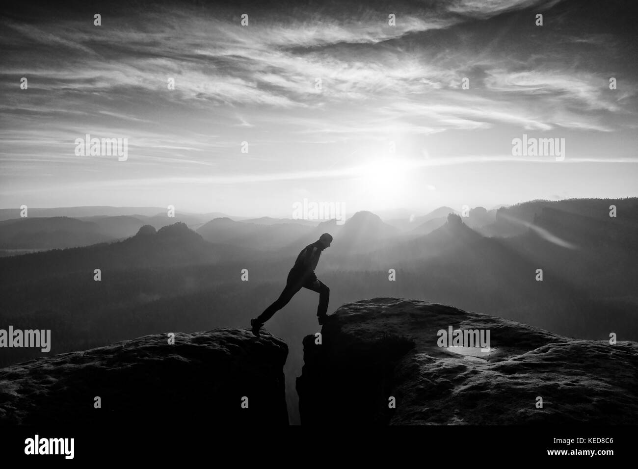 Jumping man. Young man makes jump on colorful sky background in ...