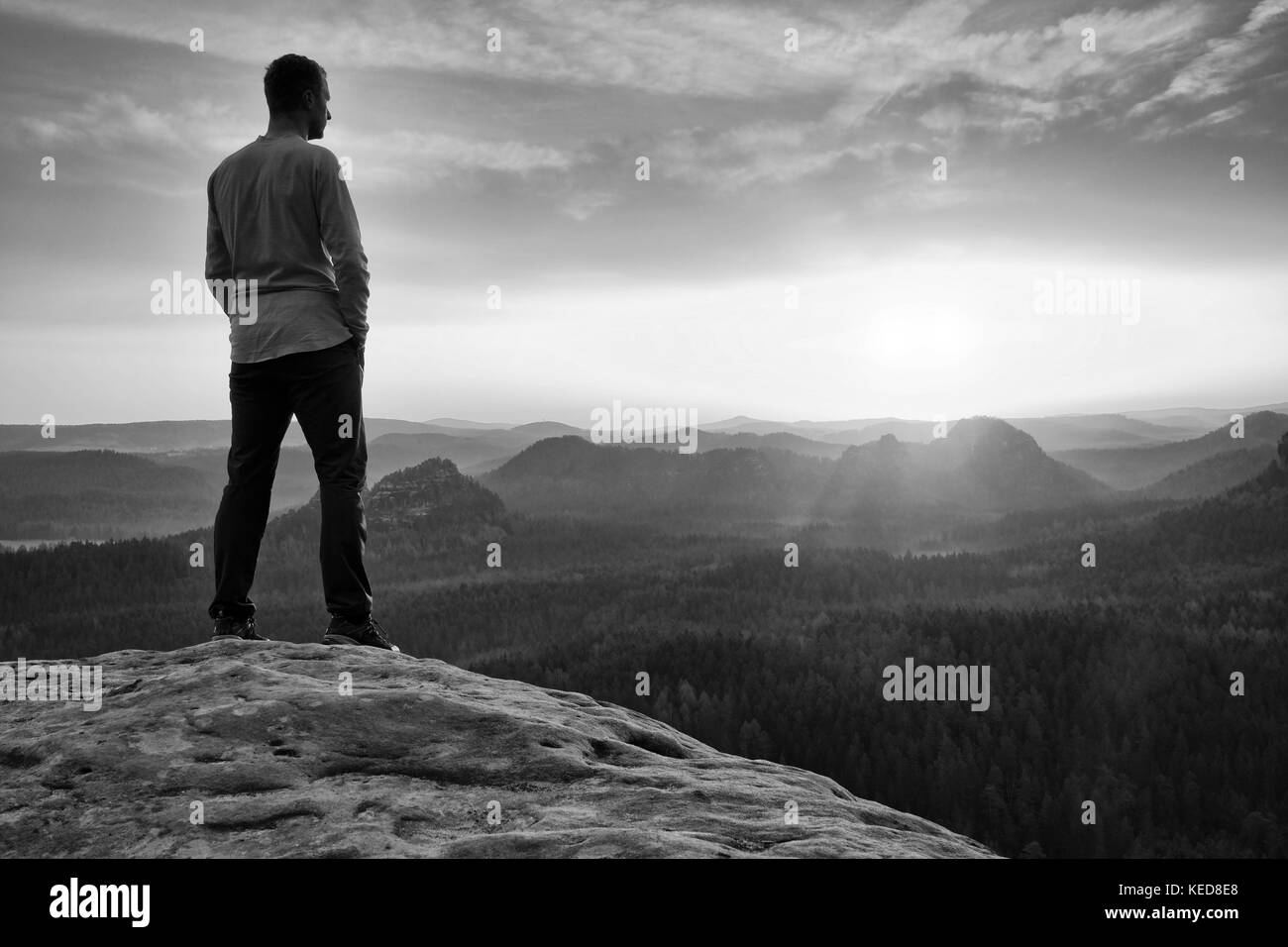 Silhouette of Young Confident and Powerful Man Standing with Hands on ...