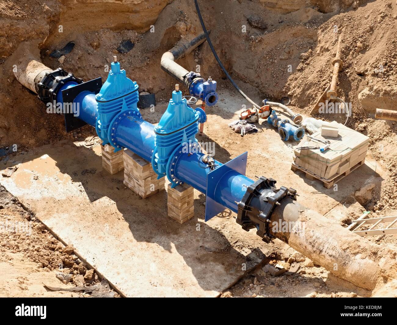 Big industrial gate valves in pipelines with big hand wheel. Repaired ...