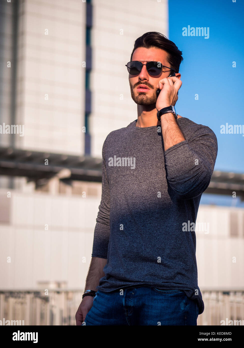 Handsome man doing a phone call Stock Photo - Alamy