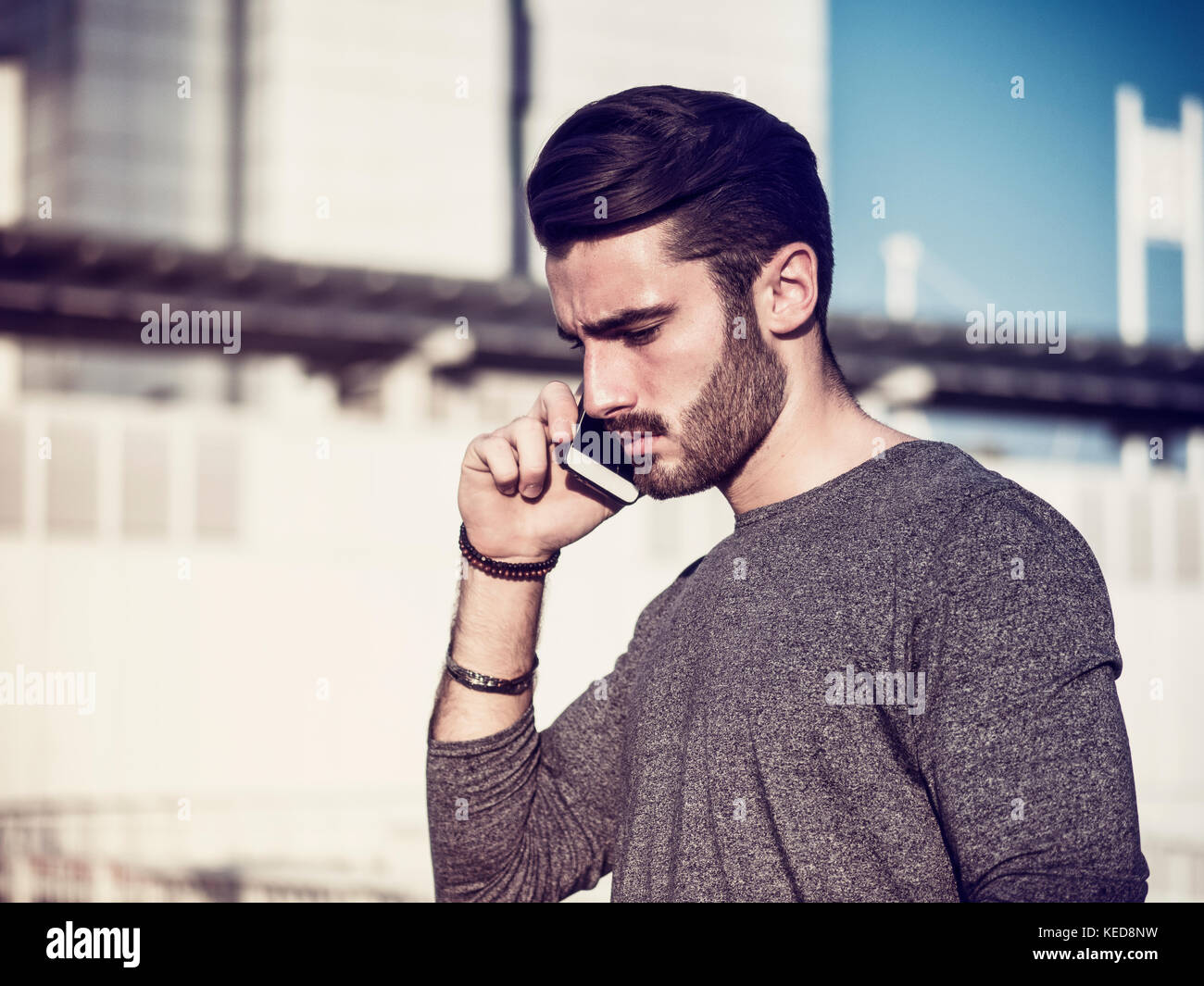 Handsome man doing a phone call Stock Photo - Alamy
