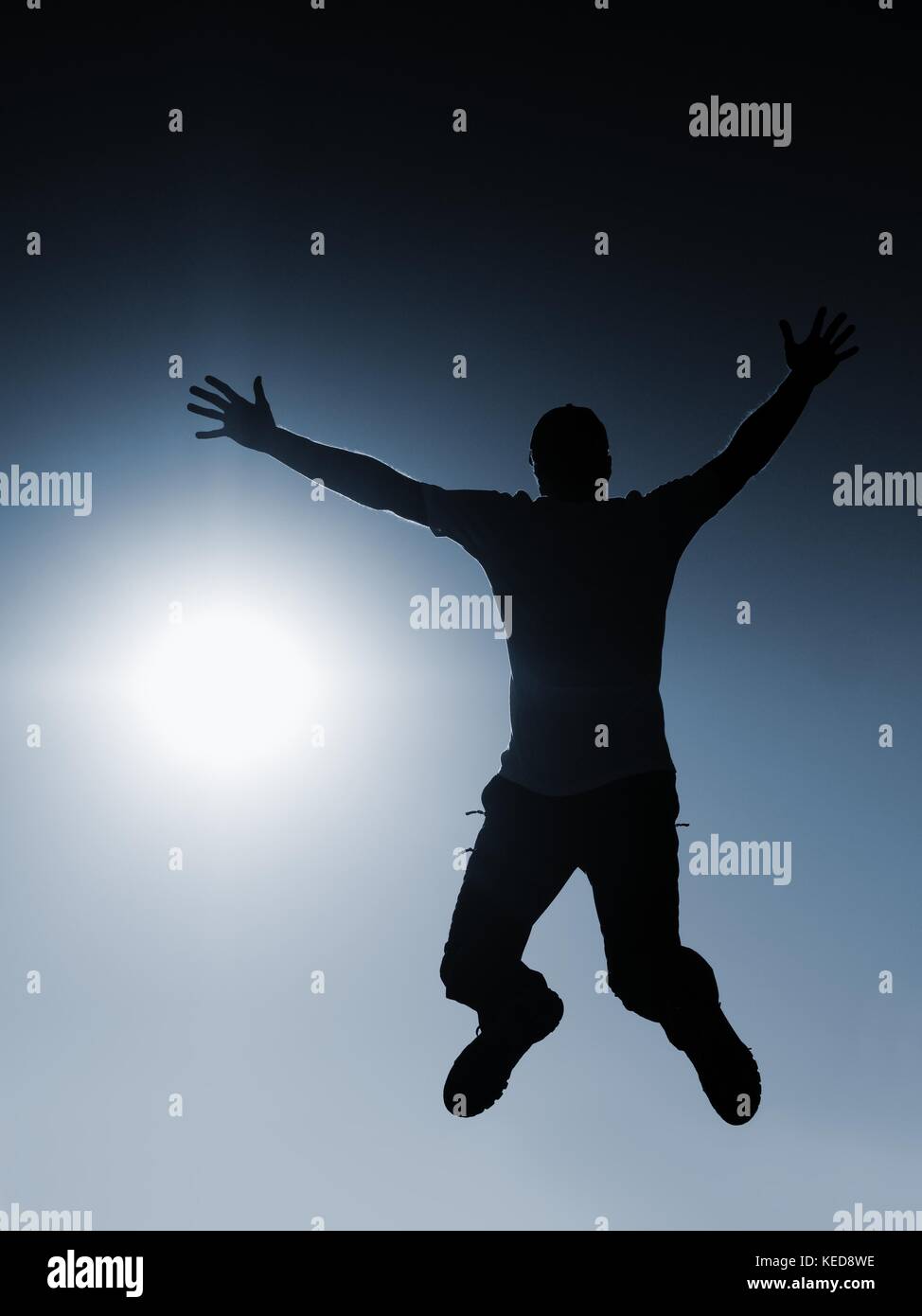 Man fly in air. Blue Toned effect. Man falling down with raised arms ...