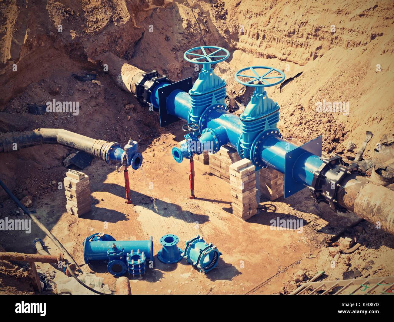 Oil, gas, water industry. Wellhead with valve armature underground. Dug ...
