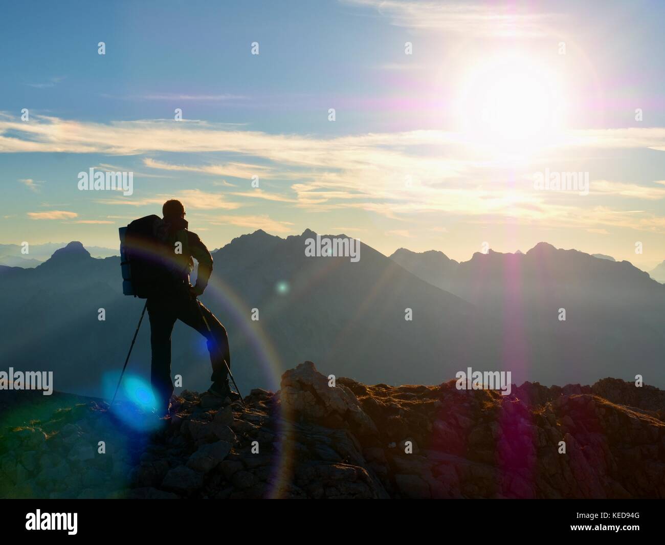 Lens flare light, strong effect. Bow light circles. Hiker takes selfie ...