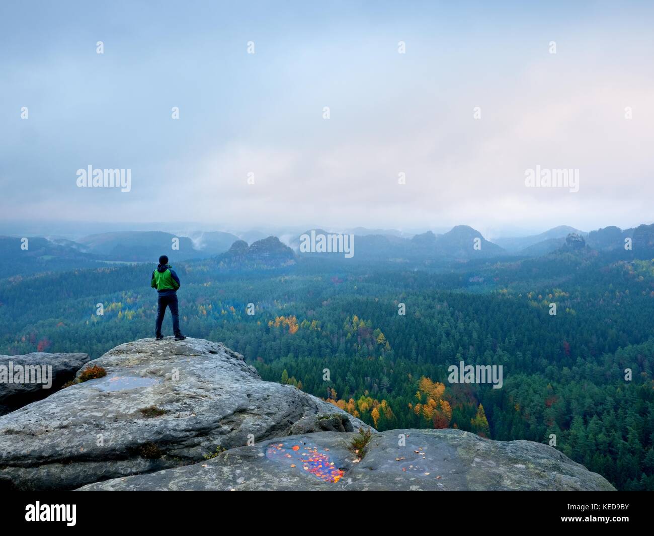 Hiker on sharp cliff of sandstone rock in rock empires park and ...