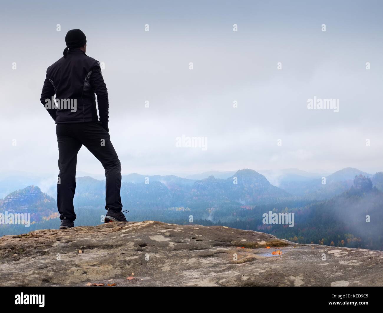 Hiker on sharp cliff of sandstone rock in rock empires park and ...