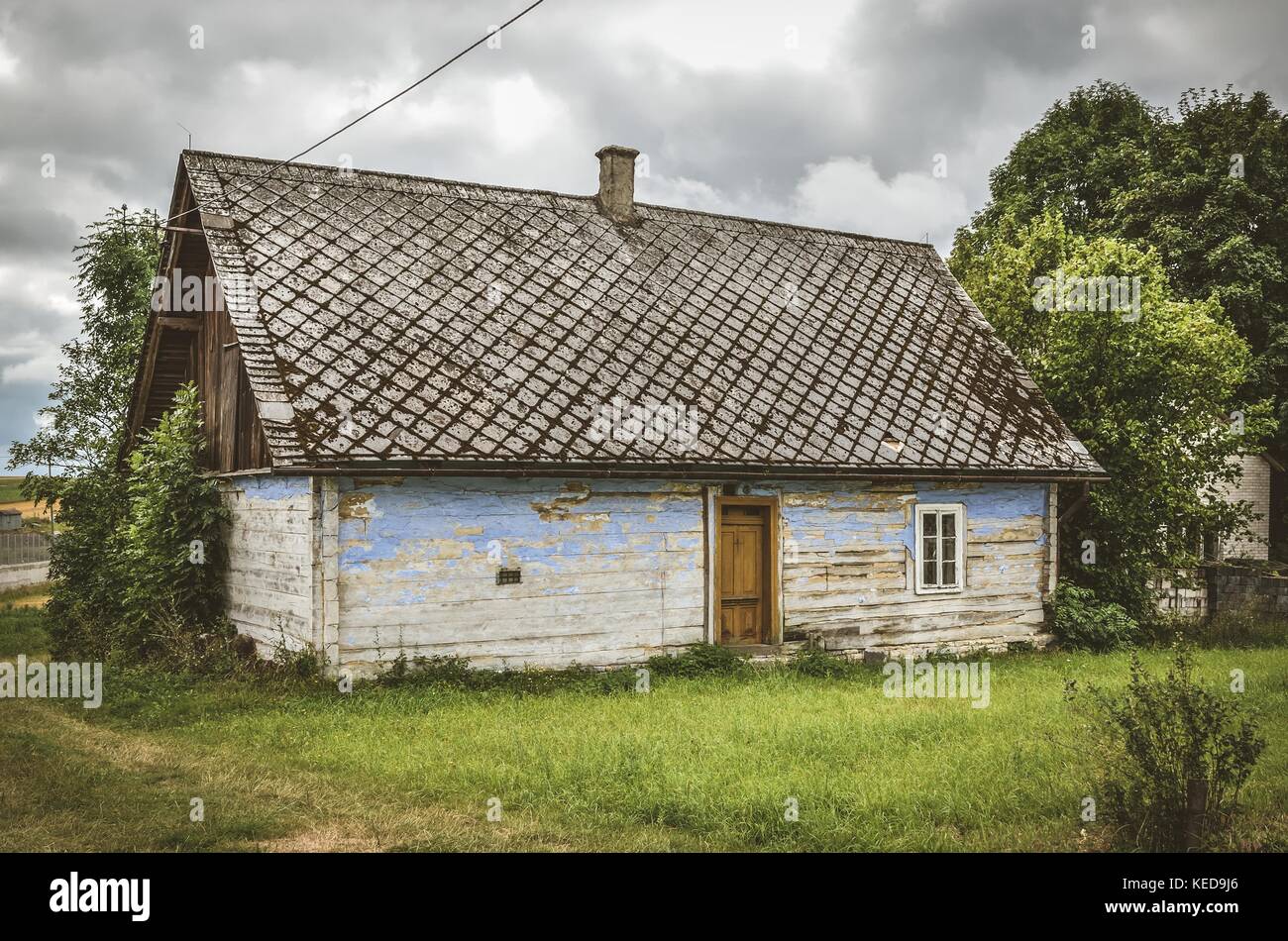 Beautiful rural scenery in vintage style. Old wooden house in the ...