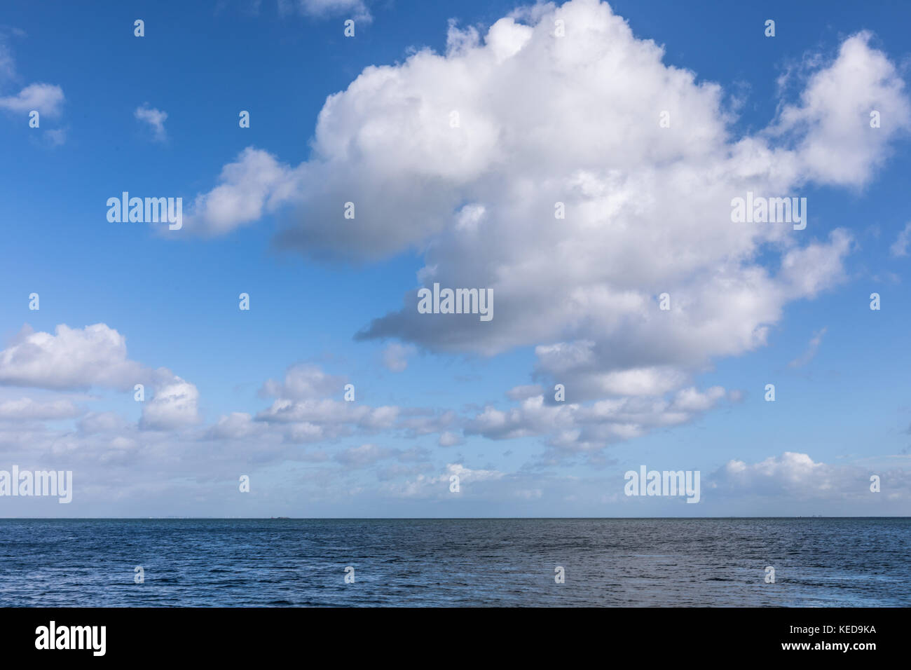 Beautiful sea under cloudy blue sky, background Stock Photo - Alamy