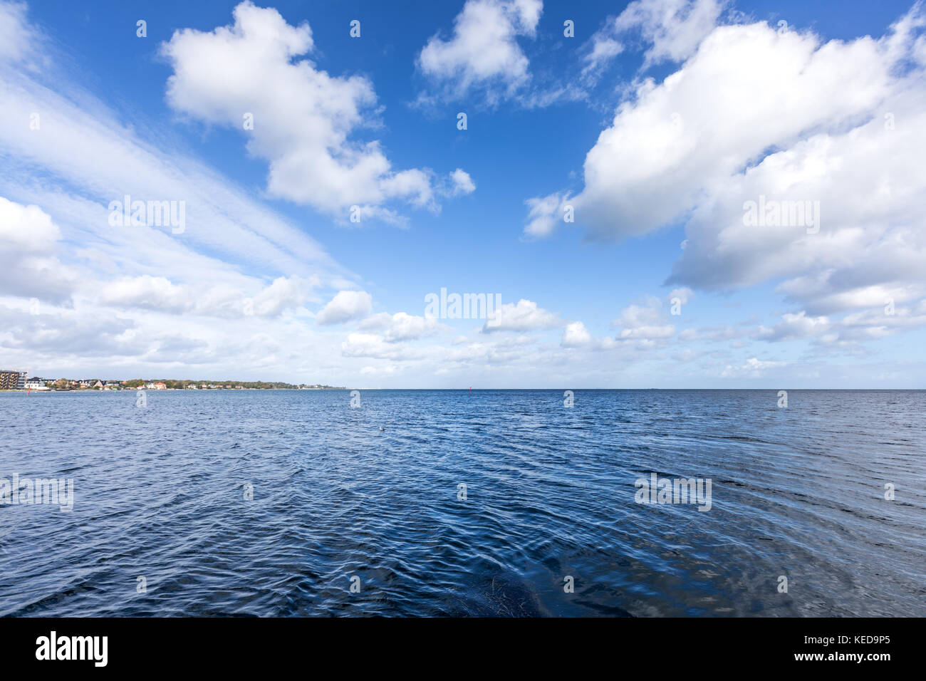 Beautiful sea under cloudy blue sky, background Stock Photo - Alamy