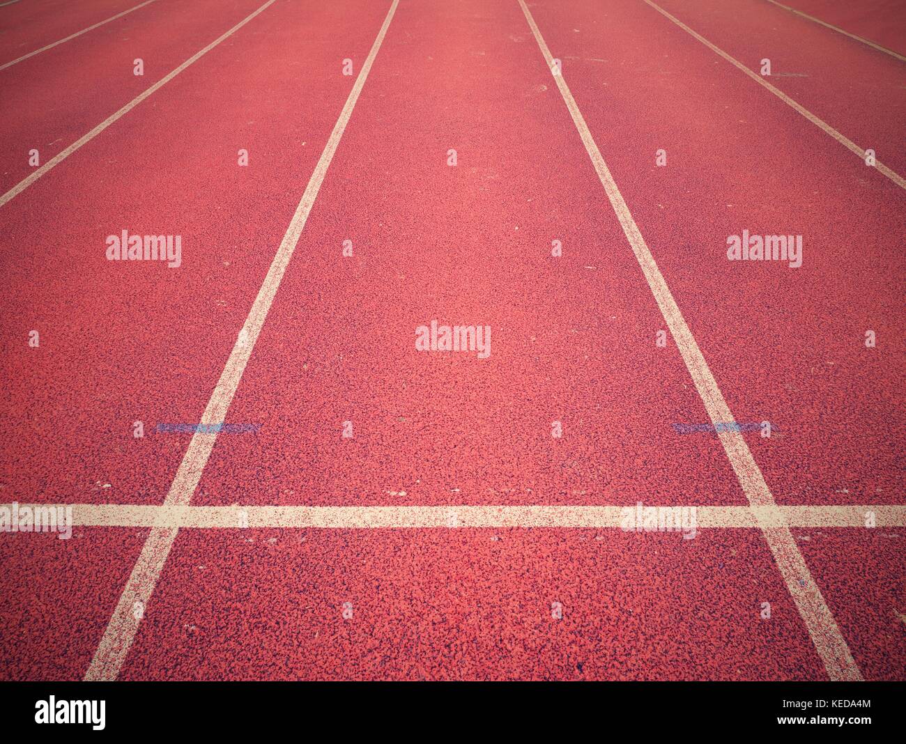 White lines and texture of running racetrack, red rubber racetracks in ...