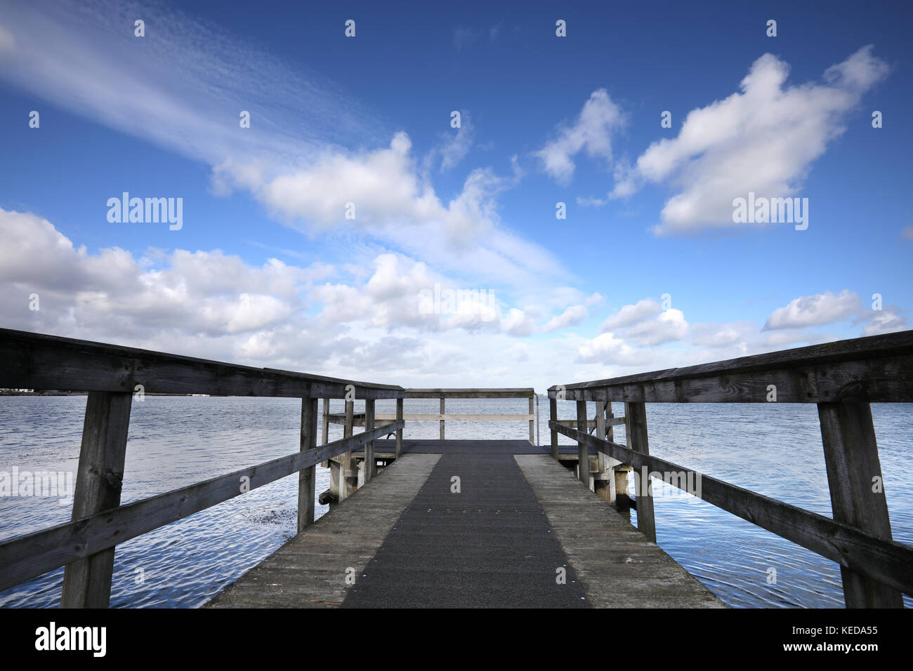 marine jetty pier with sea and beautiful sky and clouds Stock Photo - Alamy