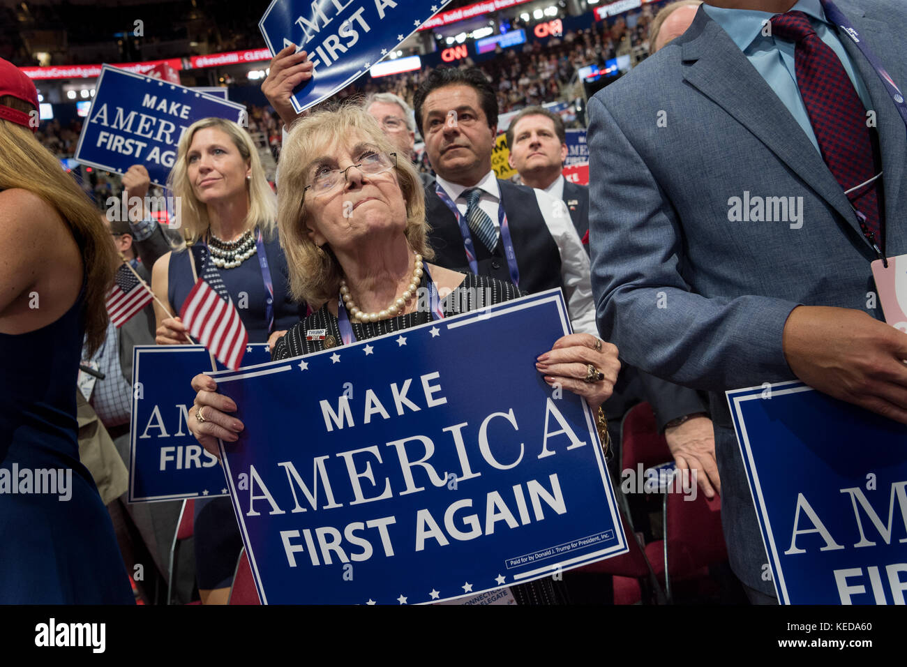 GOP delegates cheer and wave signs during the Republican National ...