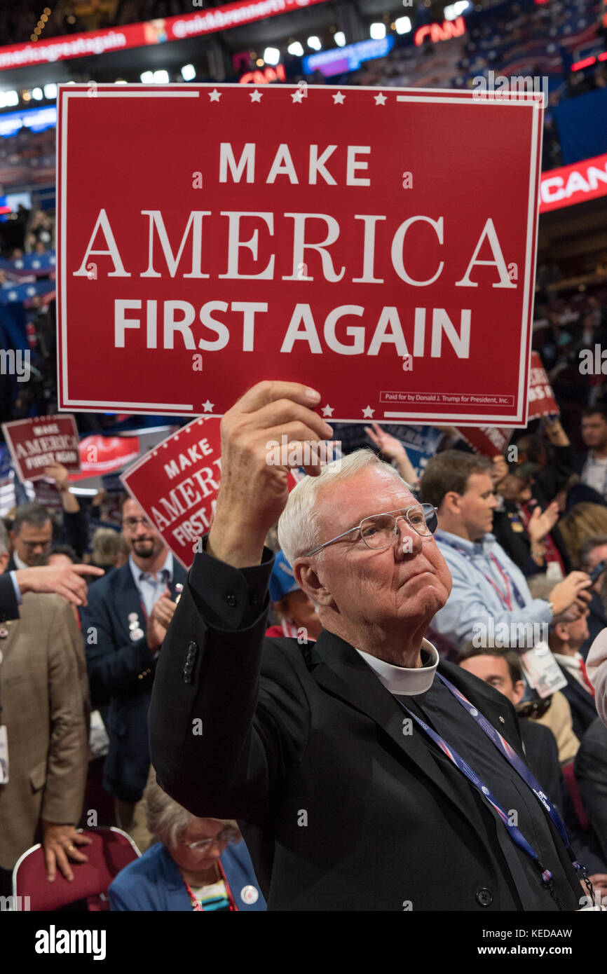 GOP delegates cheer and wave signs during the Republican National ...