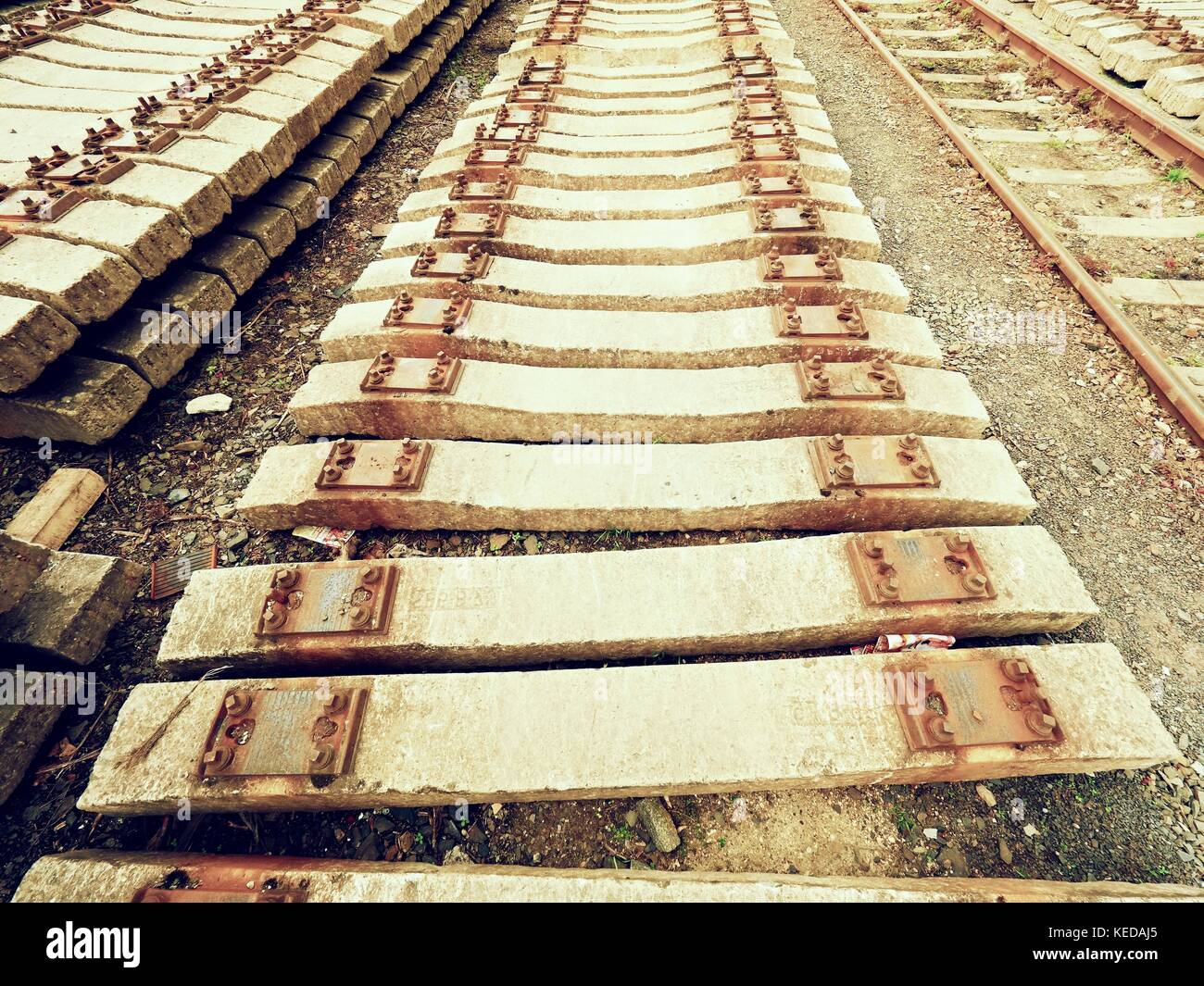Extracted old concrete sleepers in stock. Old rusty used concrete ...