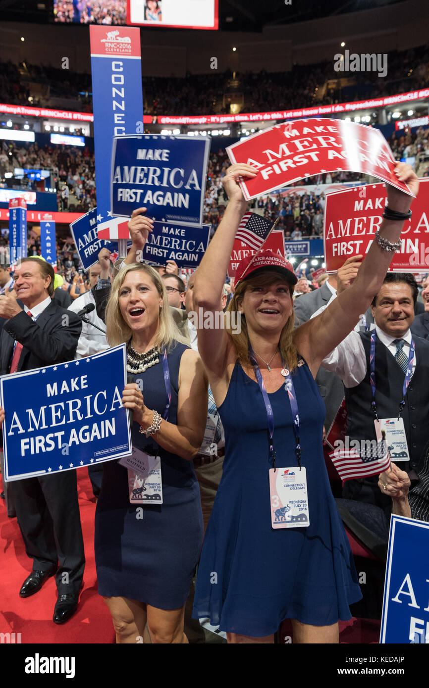 GOP delegates cheer and wave signs during the Republican National ...