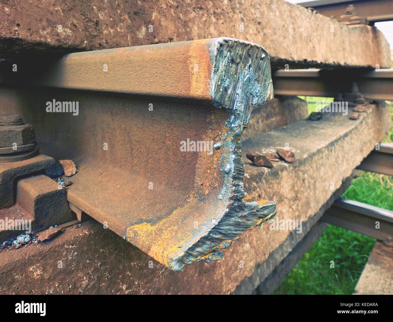 Stolen rail. Detail of autogen torch cut rail rod on concrete sleeper ...