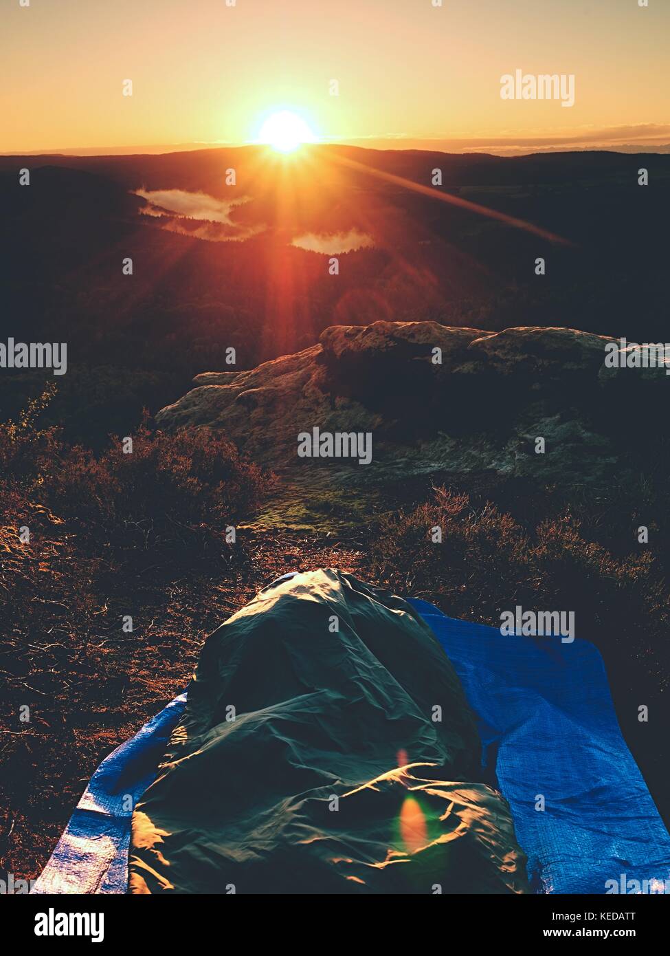 Beautiful awakening in rocks. Sleeping in nature in sleeping bag. View ...
