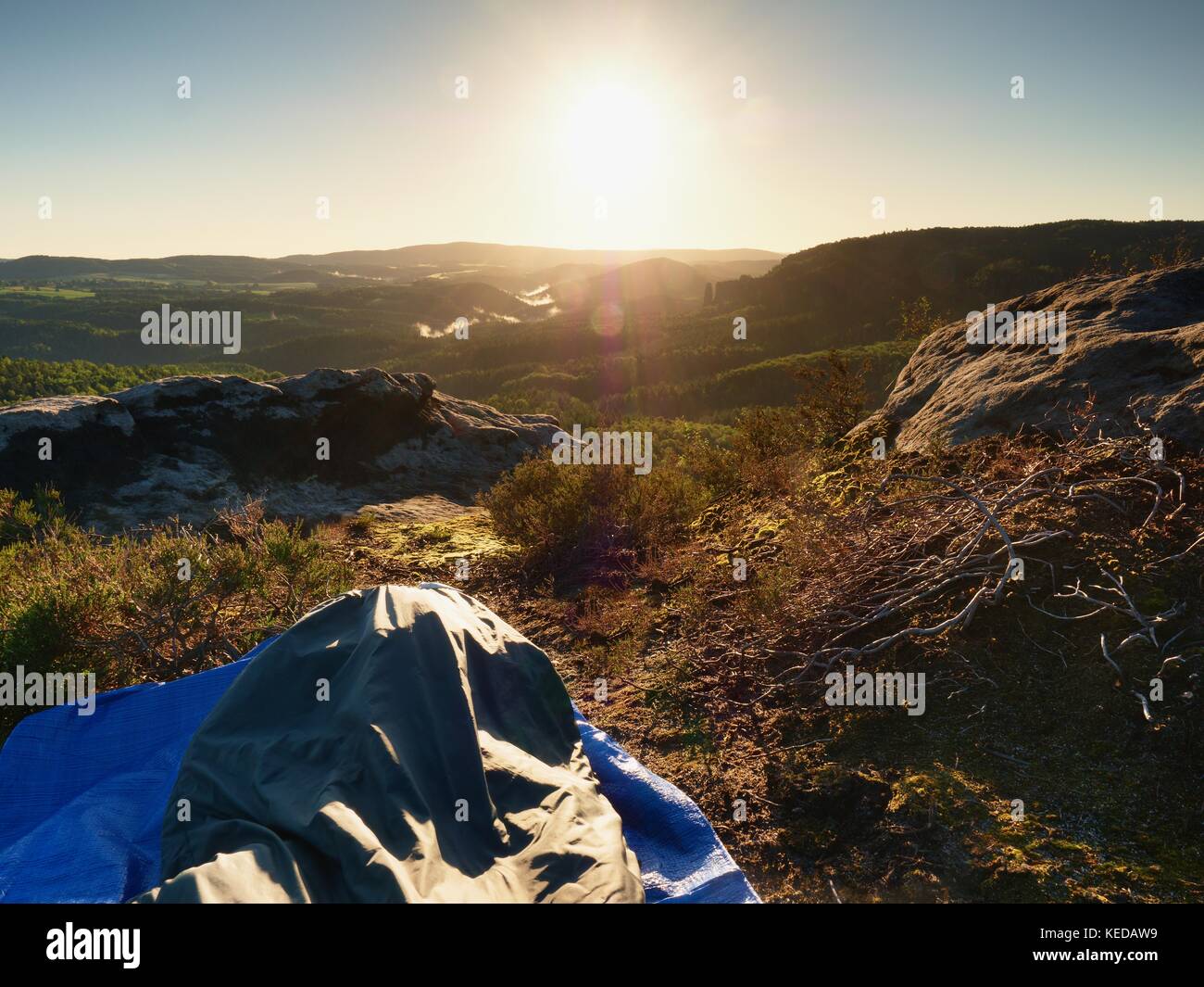 Sleeping in nature in sleeping bag. Beautiful awakening in rocks. View ...