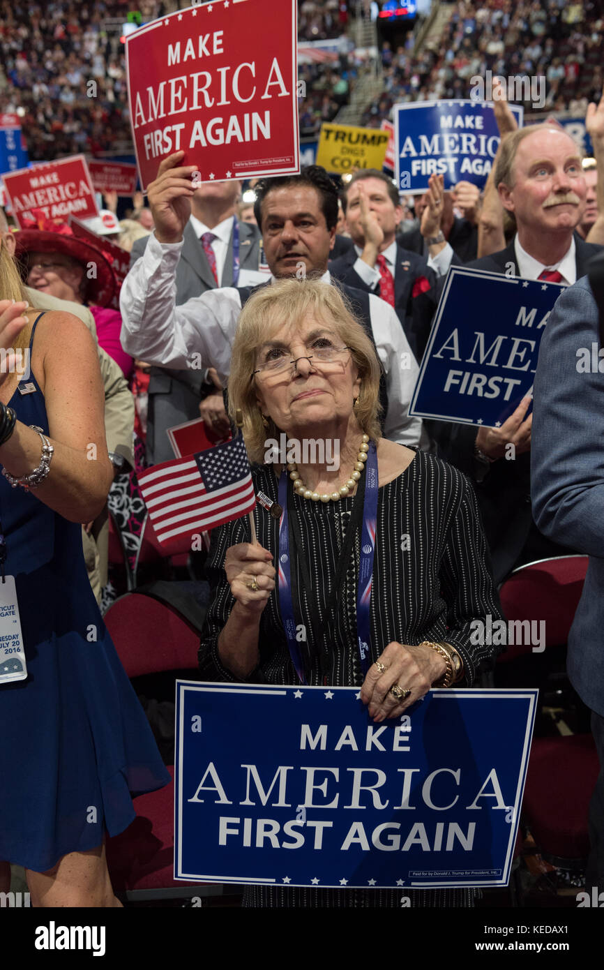 GOP delegates cheer and wave signs during the Republican National ...