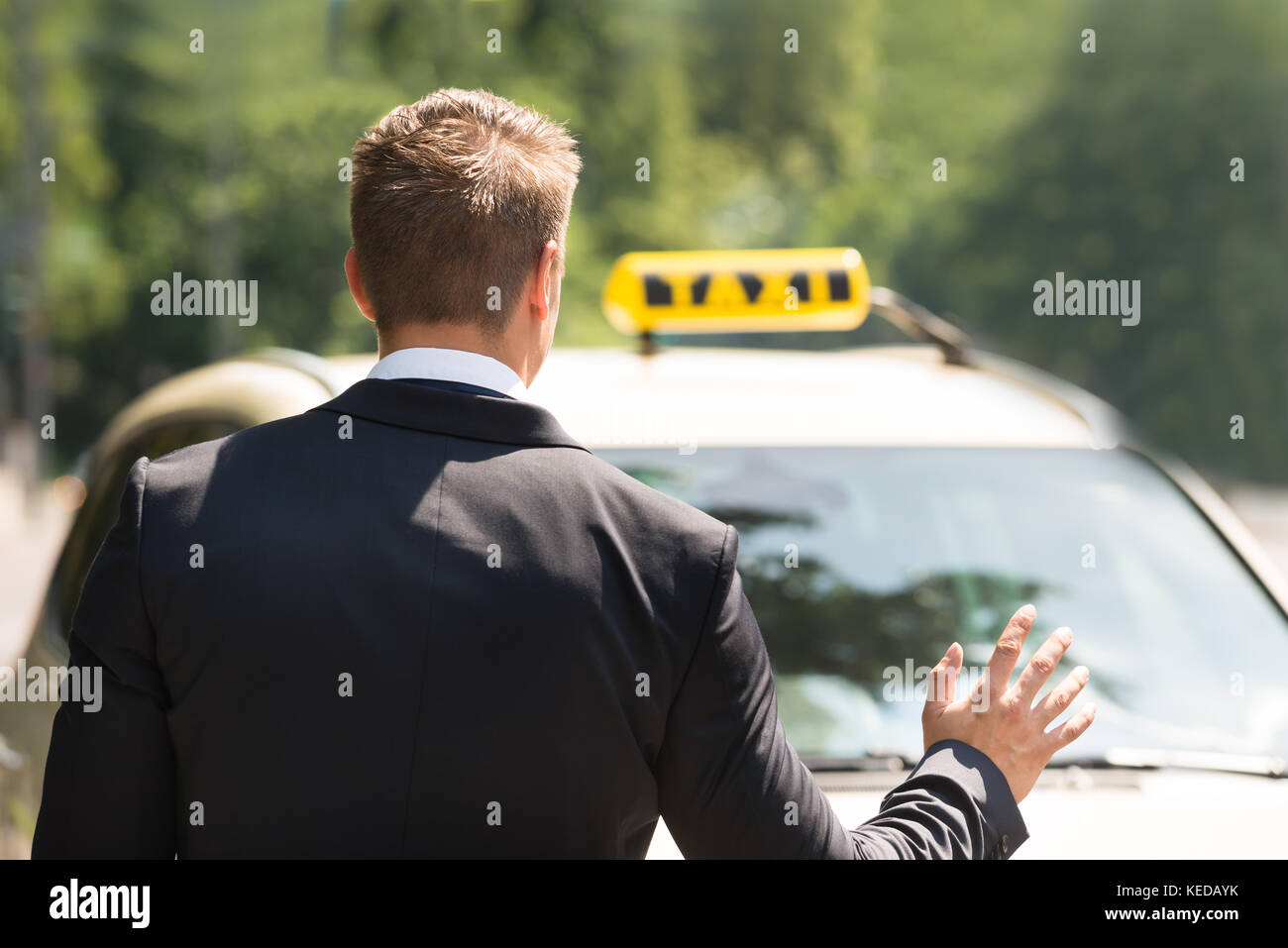Male tourist calling taxi hi-res stock photography and images - Alamy