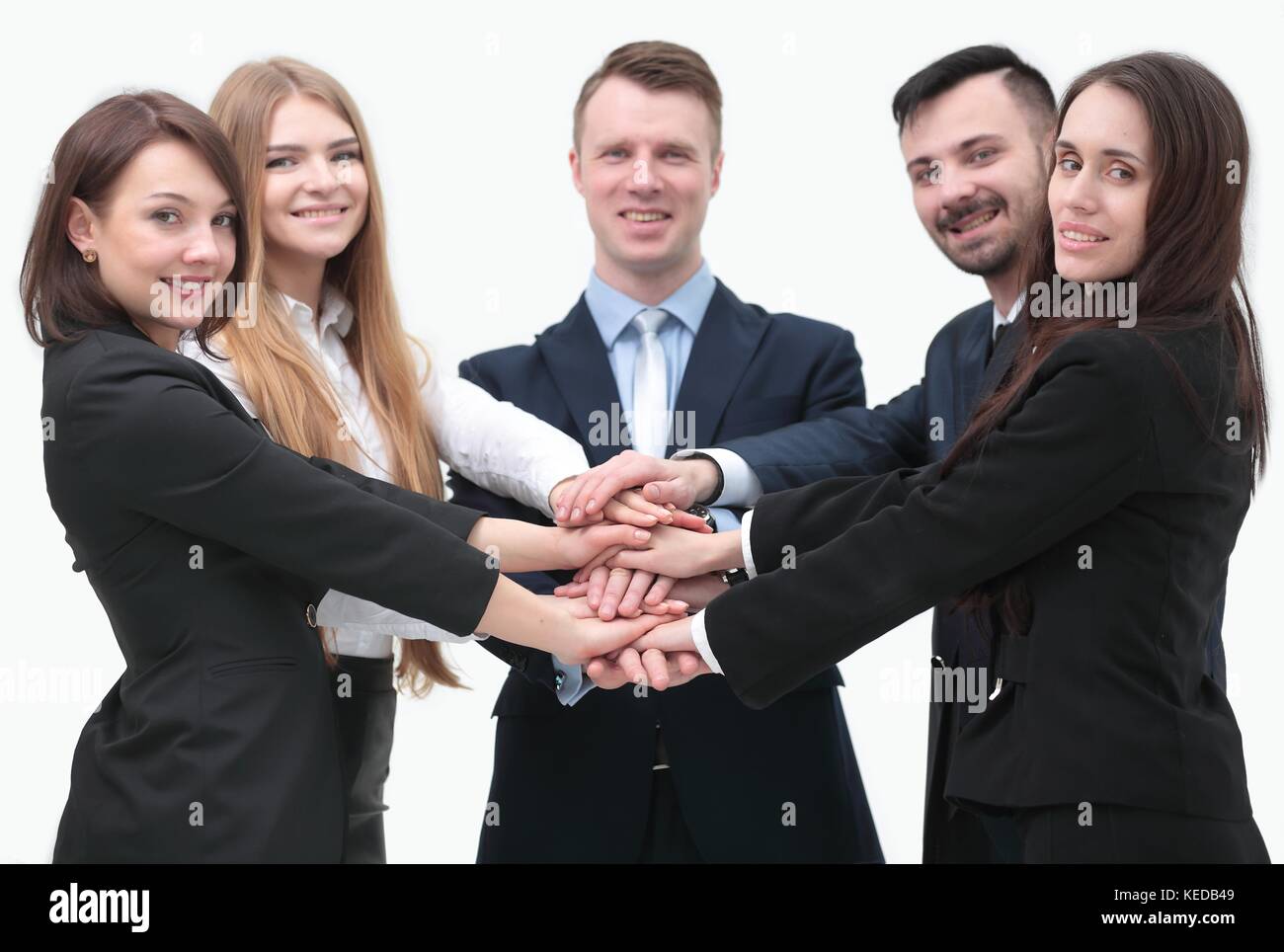 concept of unity. business team standing with folded hands together ...