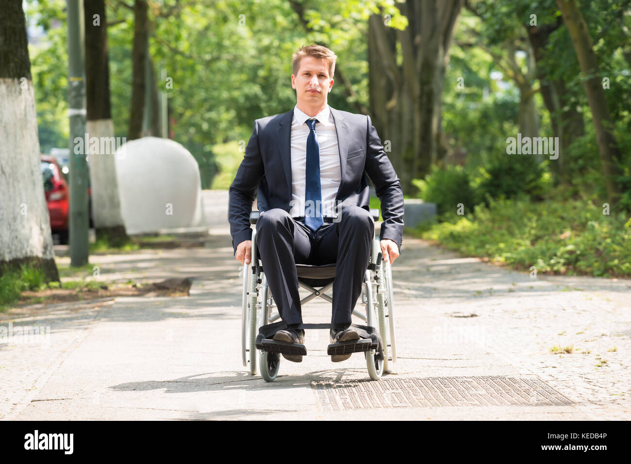 Portrait Of Young Happy Disabled Man On Wheelchair Stock Photo - Alamy