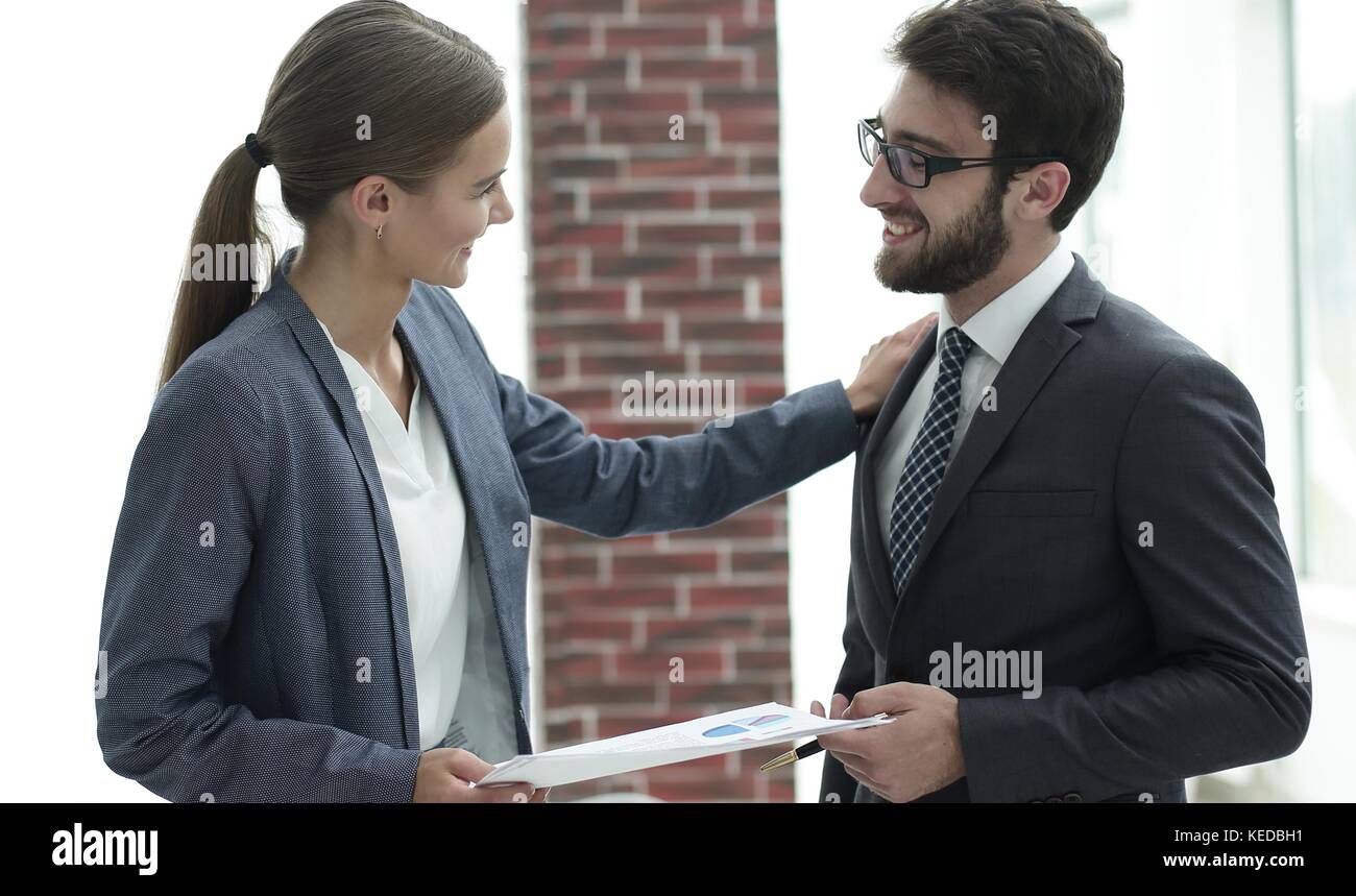 two young business Manager to discuss financial records Stock Photo - Alamy