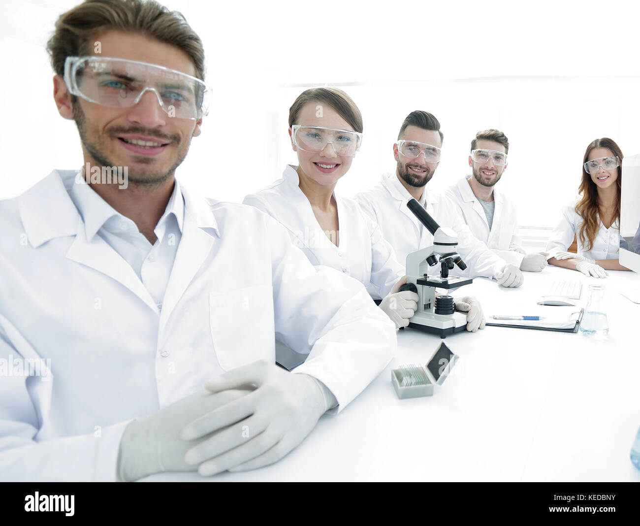 Male scientist and the team in the lab Stock Photo - Alamy